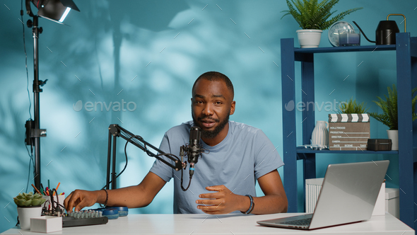 POV of vlogger recording video with camera and microphone Stock Photo ...