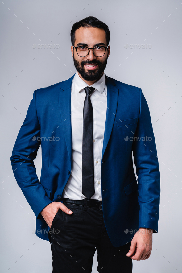 Vertical shot of a handsome middle east man in formal suit isolated ...