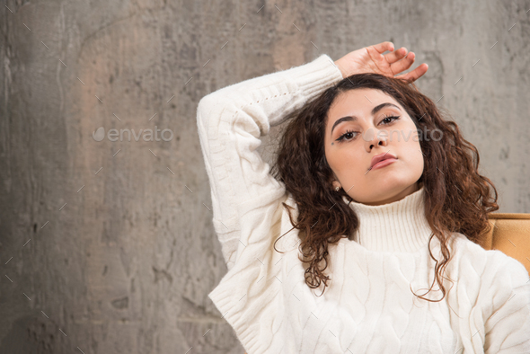 Photo of attractive lady sitting in comfy chair and posing Stock Photo ...