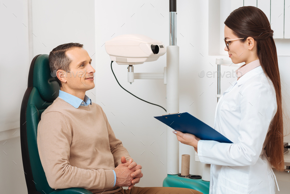 side view of patient at the oculists reception in clinic Stock Photo by ...