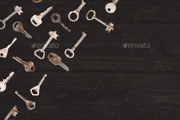 top view of different vintage keys on black table Stock Photo by ...