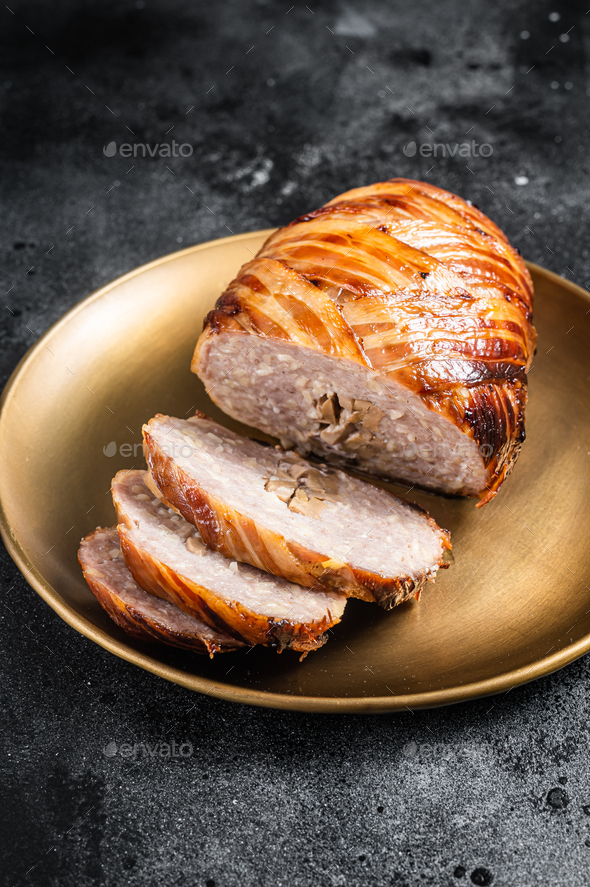Roasted bacon wrapped meatloaf, sliced mince meat loaf. Black ...