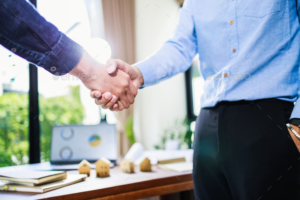 Real estate agent handshake, deal business. Business partnership ...