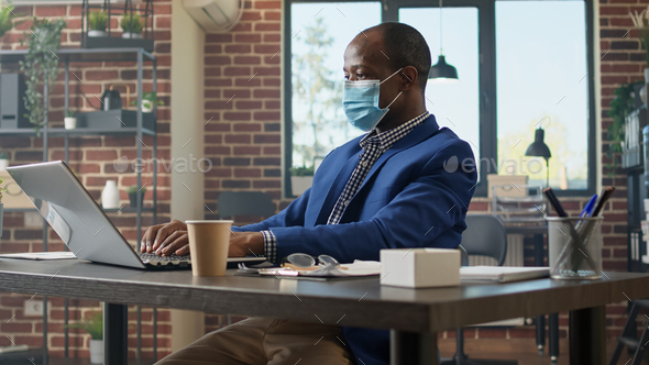 Project specialist working with company statistics on presentation ...