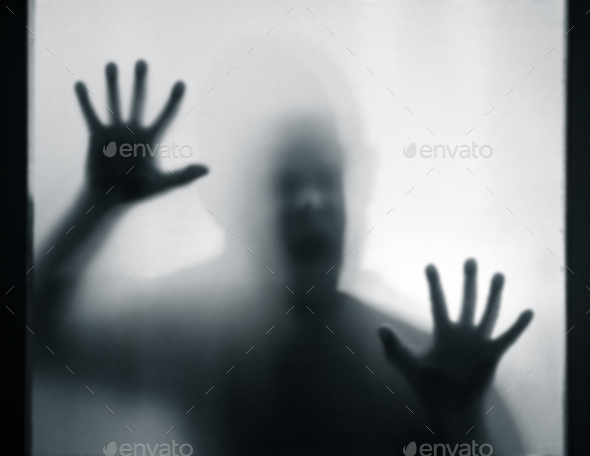 Shadowy figure behind glass - horror background Stock Photo by erika8213
