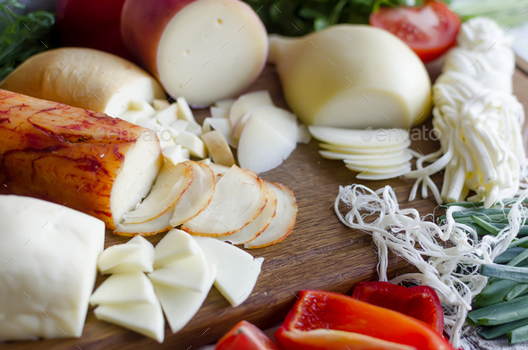 Assorted cheeses Pasta filata {Provolone) in various shapes and sizes ...