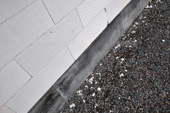 Facade of white block building under construction works. Stock Photo by ...
