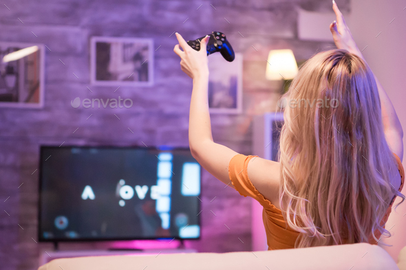 Gamer girl upset because she lost on a shooter game Stock Photo by DC ...