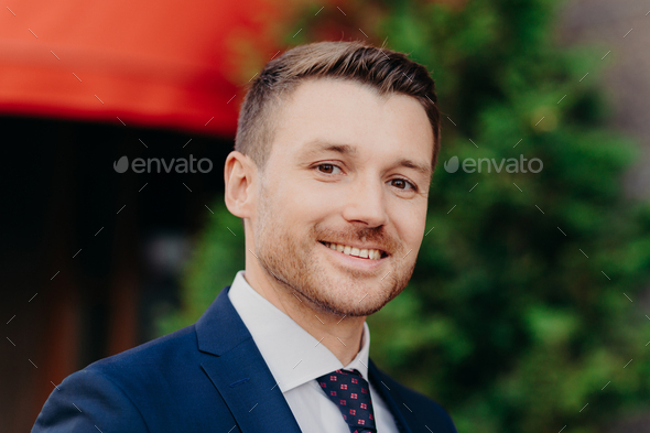 Close up portrait of handsome attractive male with gentle smile ...