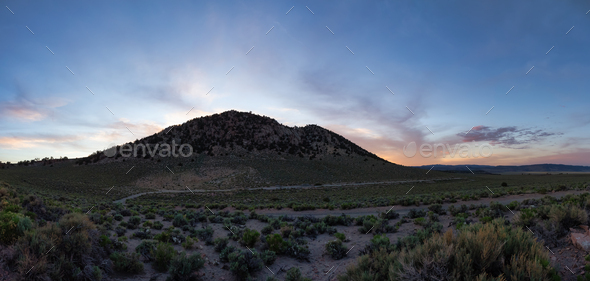 Dry rocky desert mountain landscape with trees. Sunny Sunset Sky. Stock ...