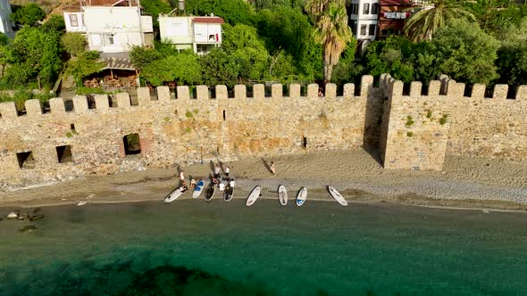 Sup surfing group aerial view 4 K Turkey Alanya, Stock Footage | VideoHive