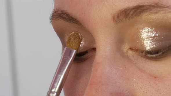 Beautiful Shiny Shadows are Applied with a Special Brush on the Eyelid ...
