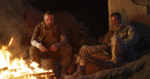 Angry Military Men Resting Near Fire, Stock Footage | VideoHive