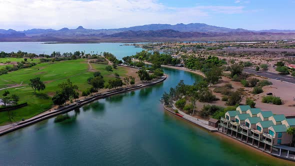 Drone aerial view flying down the beautiful canal of Lake Havasu in ...