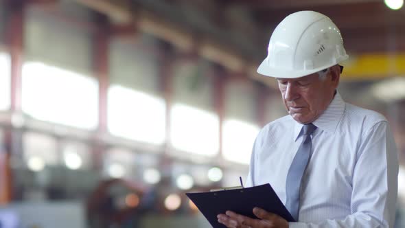 Senior facility manager observing working process, Stock Footage ...