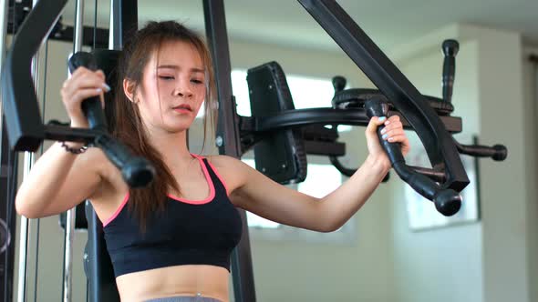 Sport Girl Work out with Chest Press Machine in Fitness Centre, Stock ...