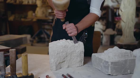 Male Hands which Creating from Limestone the Sculpture Using Chisel and ...