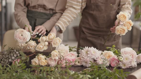 Unrecognizable Florists Sorting Roses and Chrysanthemums, Stock Footage