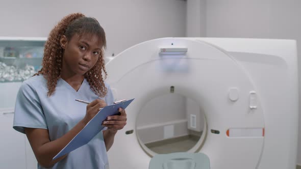 Black Female Radiologist in CT Scan Room by Pressmaster | VideoHive