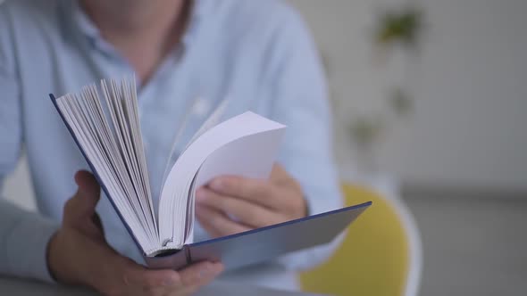 a Man Flipping Through a Book, Stock Footage | VideoHive