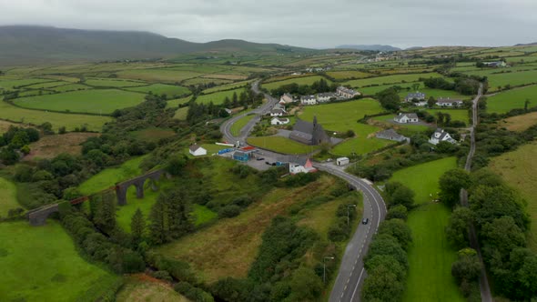 High Angle View of Road Winding Through Village with Sparse Housing ...