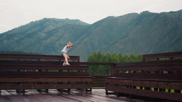 Girl Climbs on Benches Brother Walks Along Dancing Ground, Stock Footage