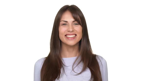 Caucasian Young Female Happily Nodding Her Head and Smiling Stadning ...