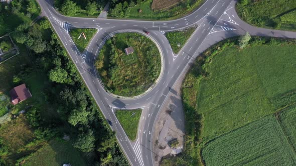 Roundabout traffic of cars and trucks on the circle ring road aerial ...