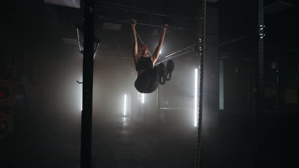 Female Athlet is Doing Exercise on Crossbar in Fitness Center Training ...