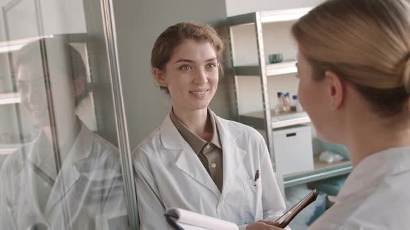 Two Female Chemists Talking in Laboratory, Stock Footage | VideoHive