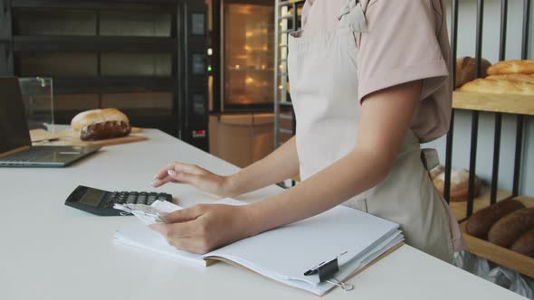Female Counter Attendant Working in Bakery, Stock Footage | VideoHive
