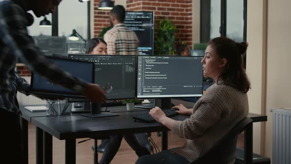 Junior Developer Putting Laptop with Source Code on Senior Dev Desk ...