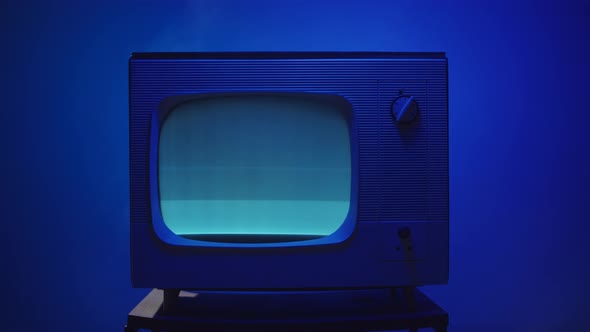 Old Vintage Television on Blue Neon Background Closeup, Stock Footage