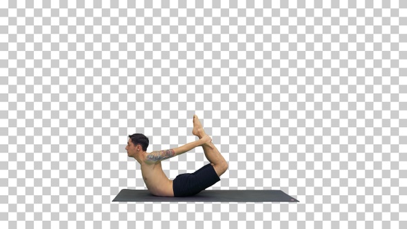 Sporty muscular young yogi man doing backbend exercise, Stock Footage