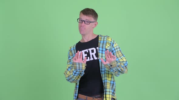 Portrait of Nerd Man Waving Hand No, Stock Footage | VideoHive