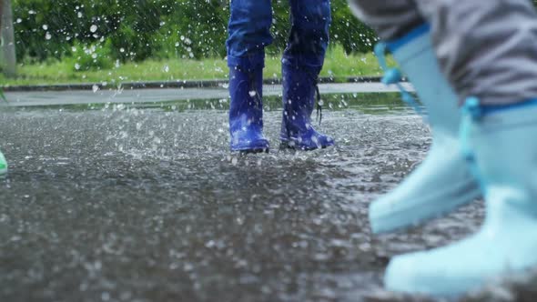 Children Playing in Puddle, Stock Footage | VideoHive
