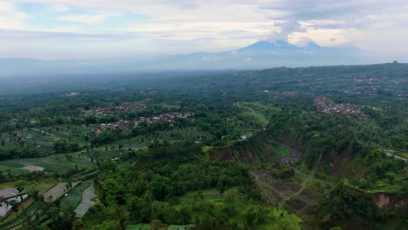 Rural landscape of Javanese countryside with volcano at background ...