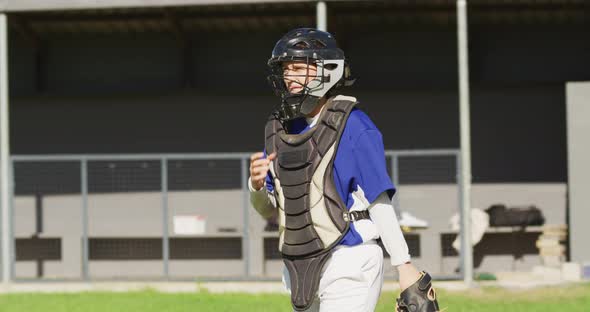 Disappointed caucasian female baseball player, taking off helmet and ...