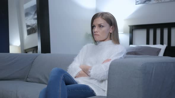 Angry Woman Sitting on Couch at Home, Stock Footage | VideoHive