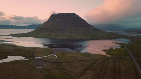 Slow ascent next to the icelandic Mt. Kirkjufel reveals the perspective ...