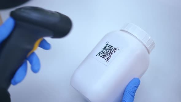 Closeup Scanning QR Code on Pills Bottle Passing Medication to Client ...