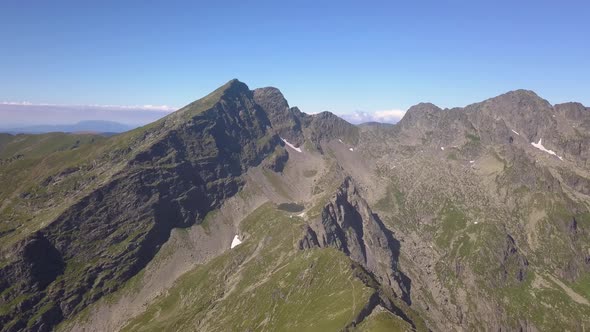 Amazing high altitude scenery of mountain peaks and narrow ridges with ...