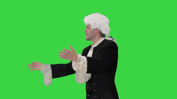 Man Dressed Like Wolfgang Amadeus Mozart Conducting an Orchestra on a ...