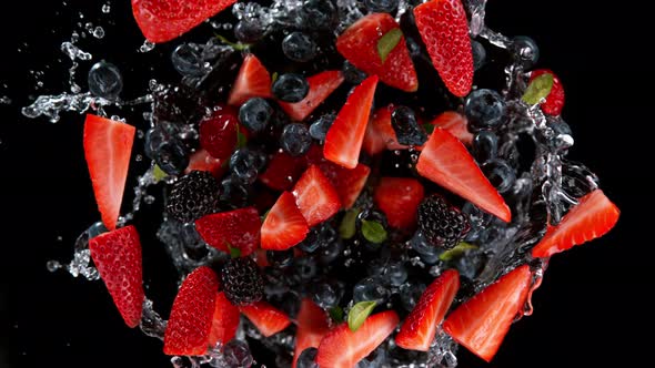 Super Slow Motion Shot of Rotating Exploded Berries Fruit with ...