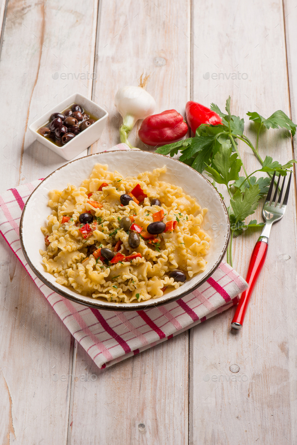 mafalde pasta with capsicum black olives and onions Stock Photo by ...