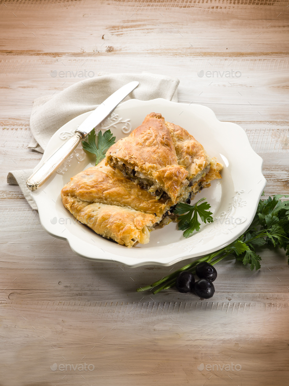 strudel stuffed with tuna and black olives Stock Photo by MarcoMayer