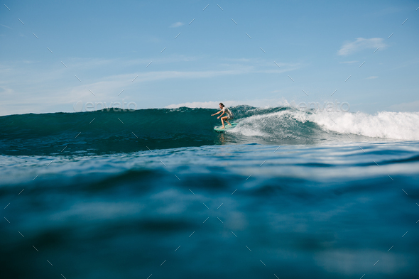 handsome man riding waves on surfboard while having vacation Stock ...