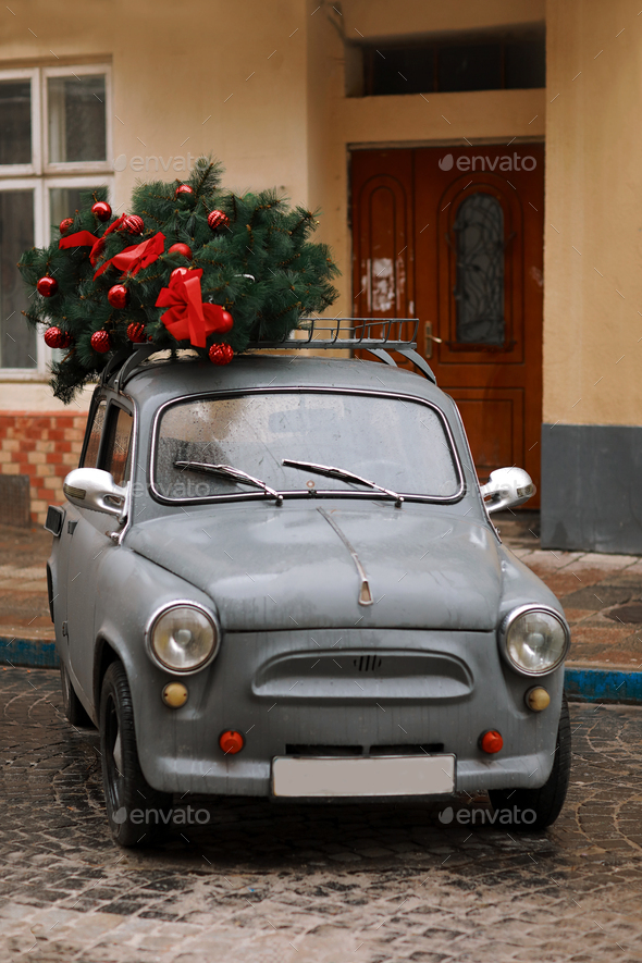 View of a red retro car with Christmas tree. Winter. Christmas. gray ...