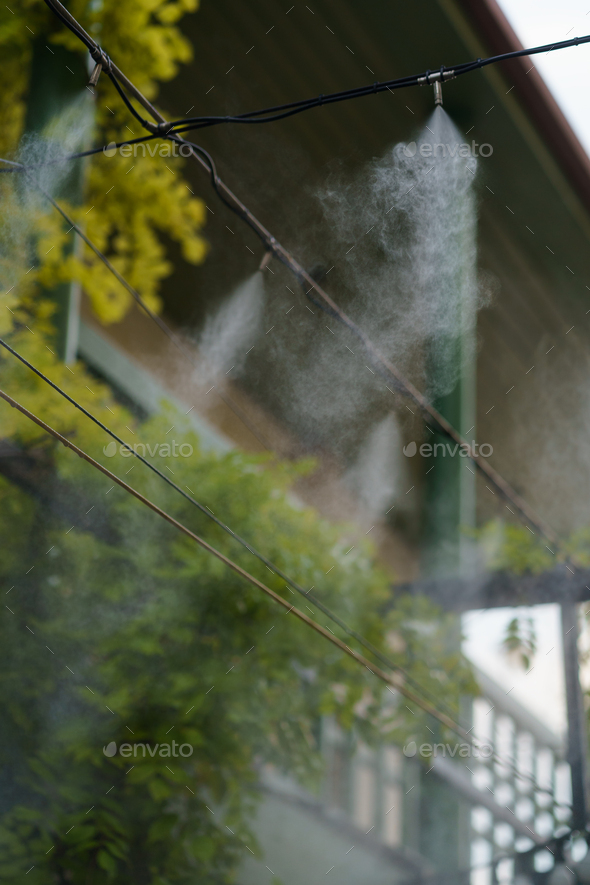 Automatic water spray system to create a cooling effect in hot weather ...