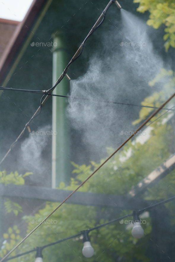 Automatic water spray system to create a cooling effect in hot weather ...